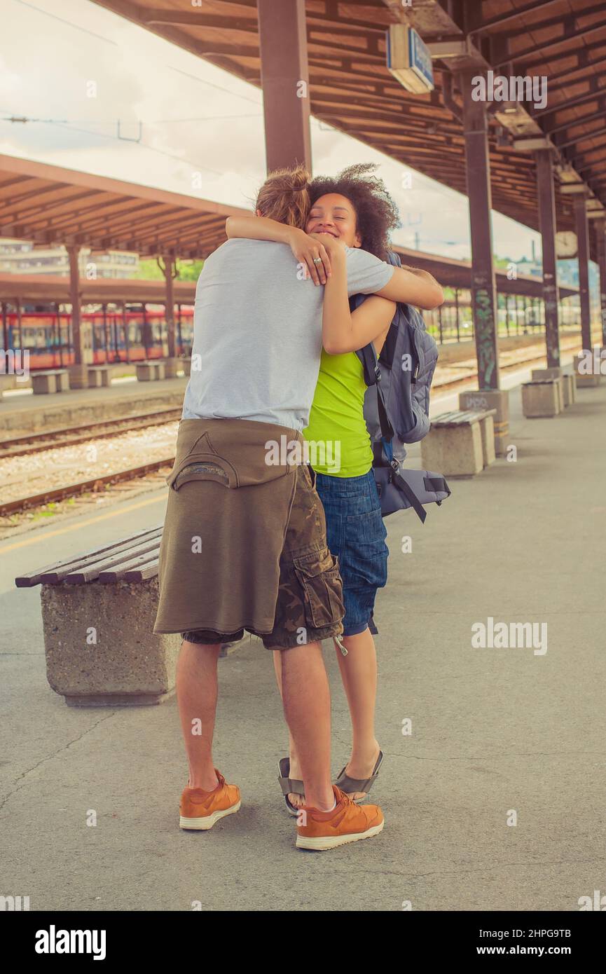 Man meeting his girlfriend from her trip at the train station Stock ...