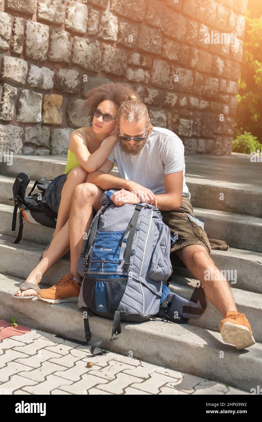 Romantic couple relaxing in the street Stock Photo - Alamy