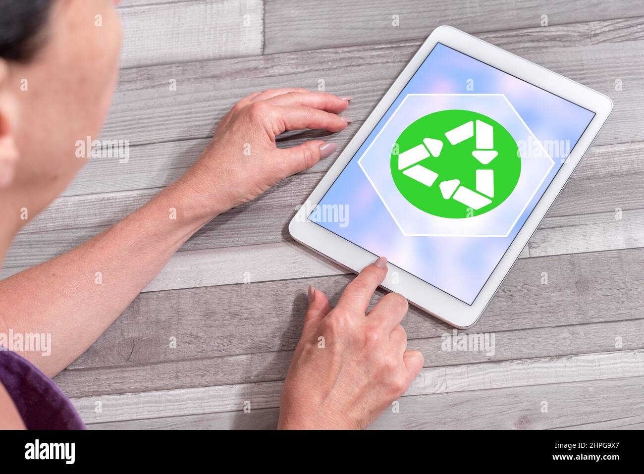 Woman using a tablet showing recycling concept Stock Photo - Alamy