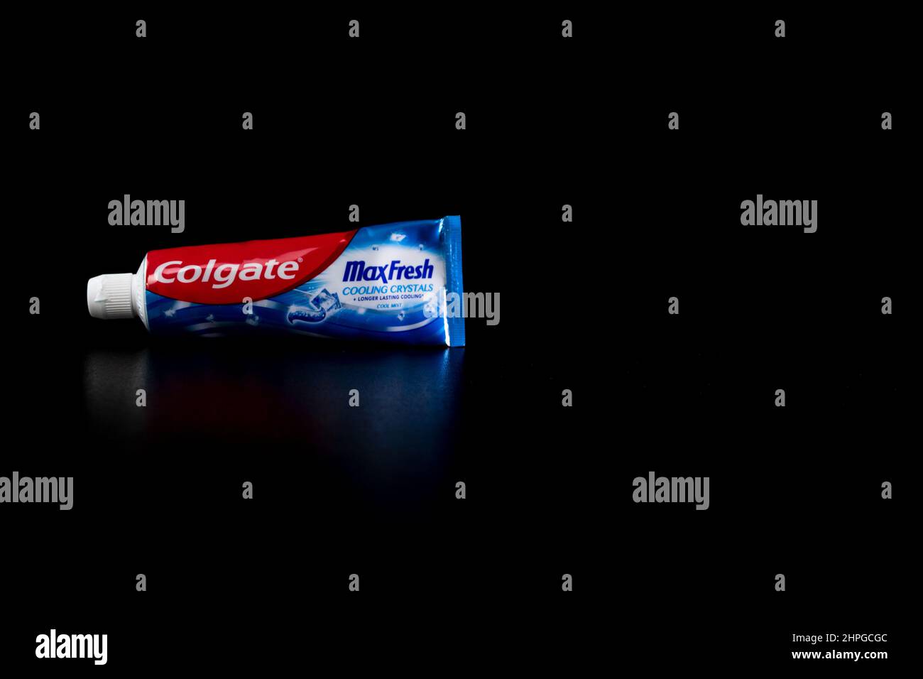 Colgate MaxFresh toothpaste tube on black background in Bucharest ...