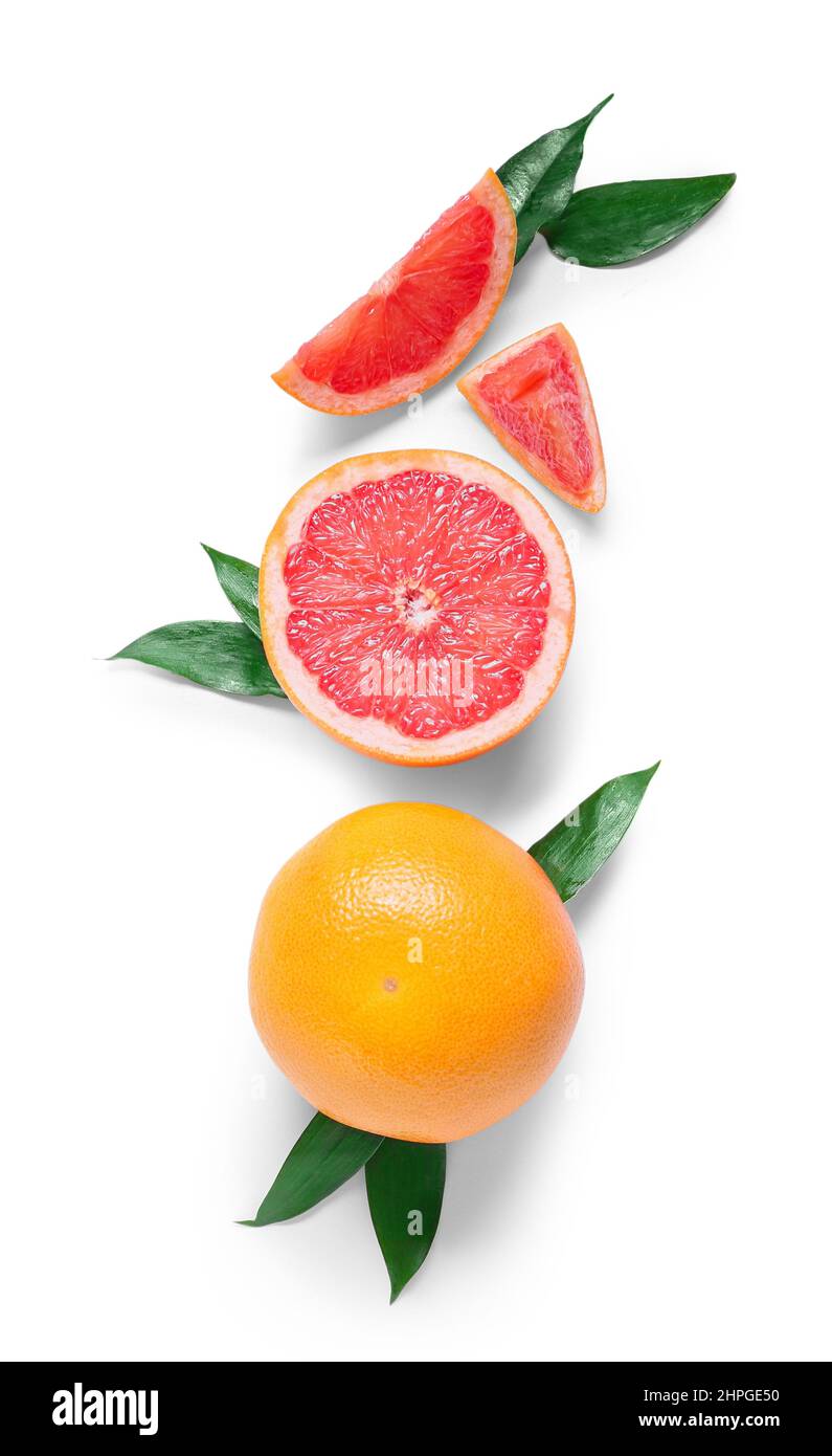 Fresh grapefruit pieces on white background Stock Photo - Alamy