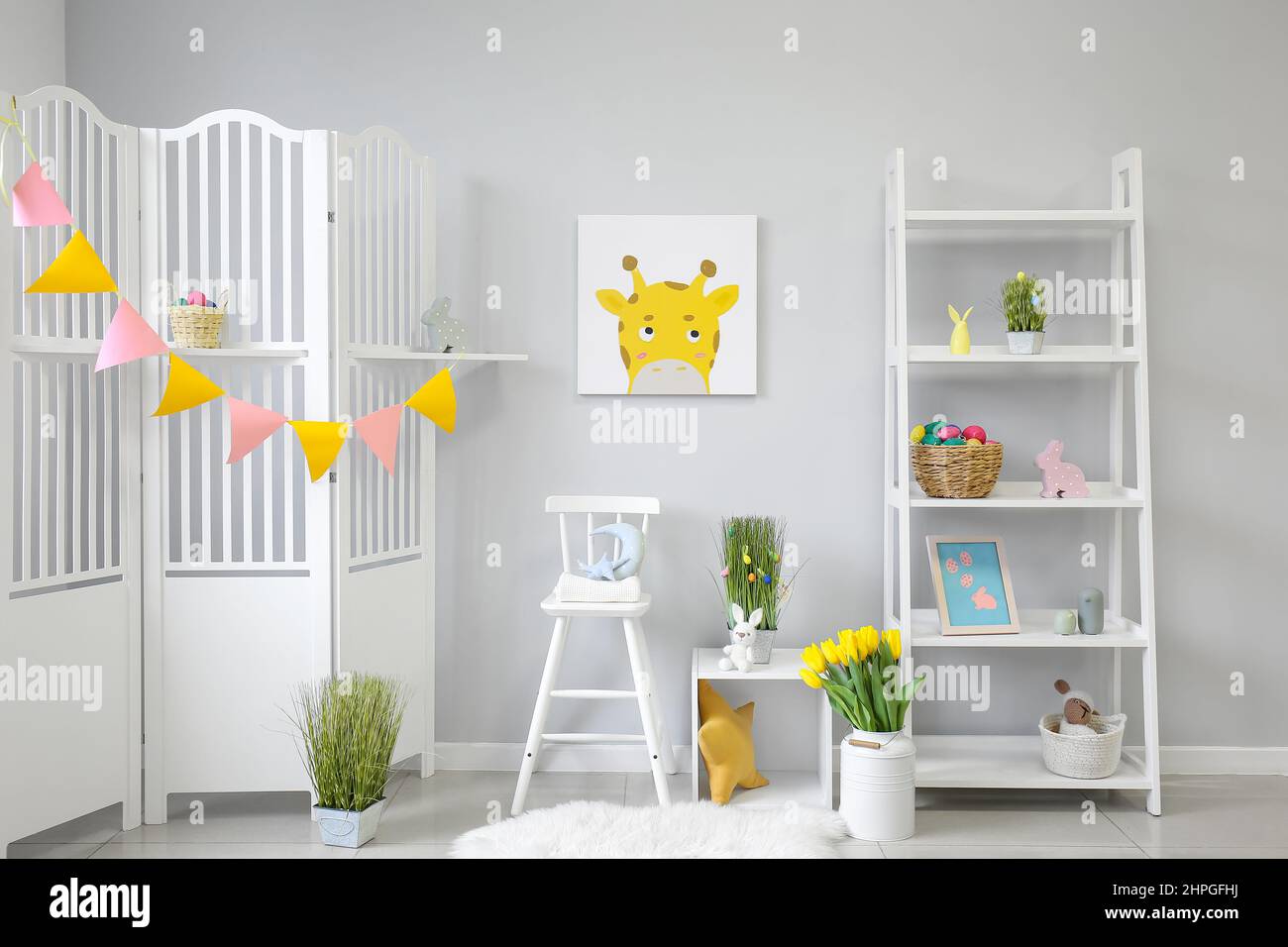 Interior of stylish children's room decorated for Easter celebration ...