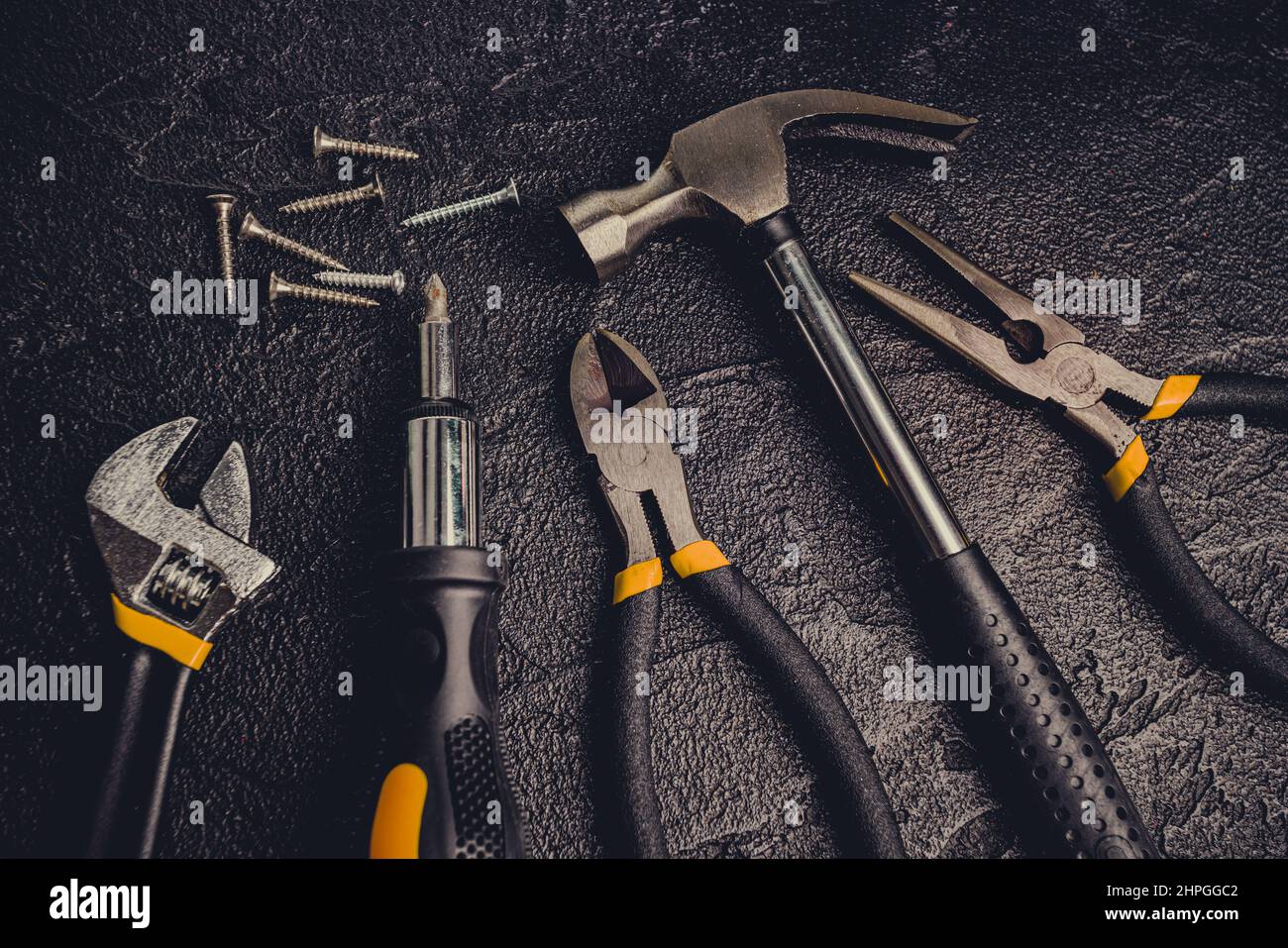Tools for master builder on a black background Stock Photo - Alamy