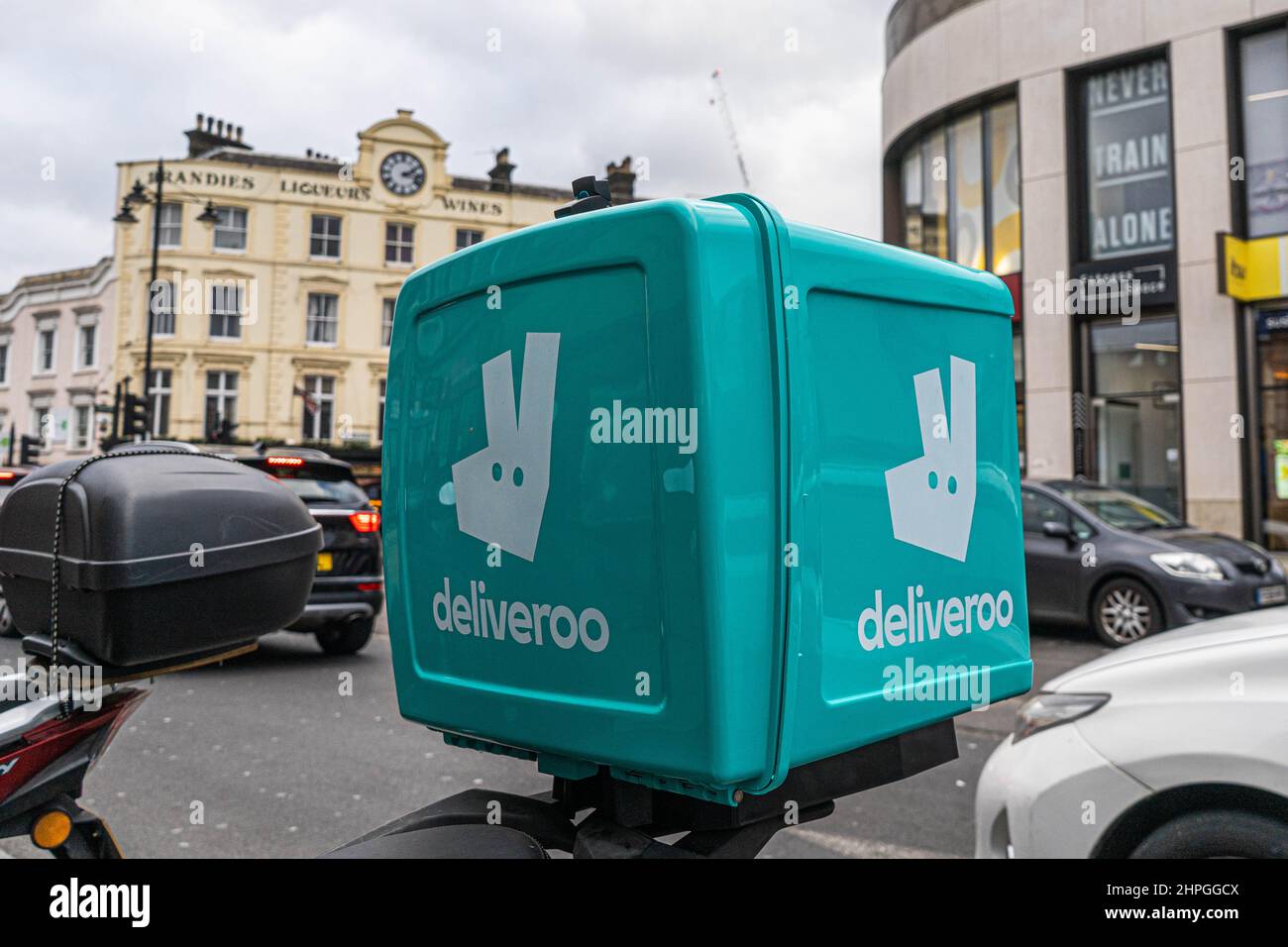 WIMBLEDON LONDON, UK. 21 February, 2022. Deliveroo riders stand idle in ...