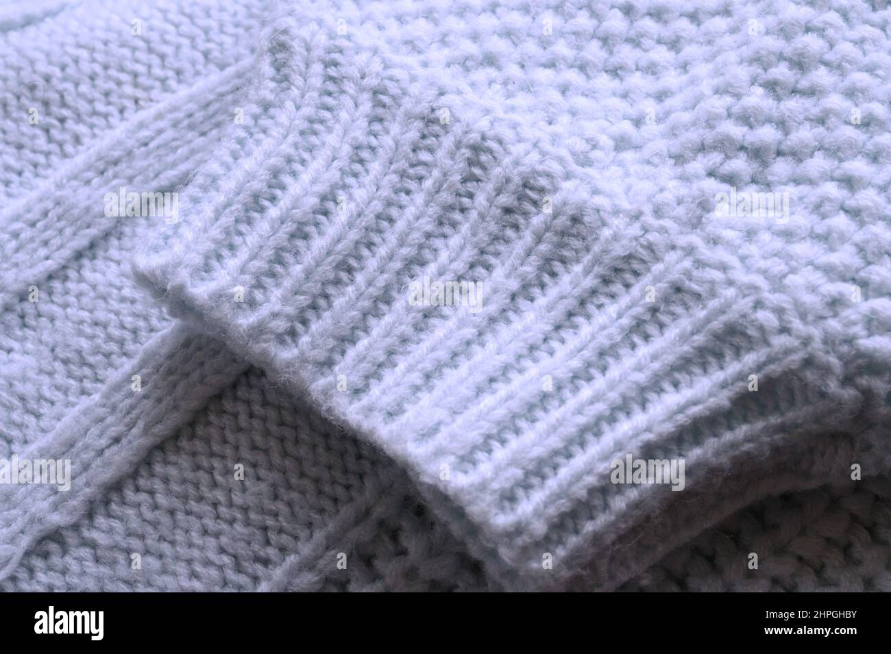 Ribbed sleeve cuff of woman's acrylic knitted sweater Stock Photo - Alamy