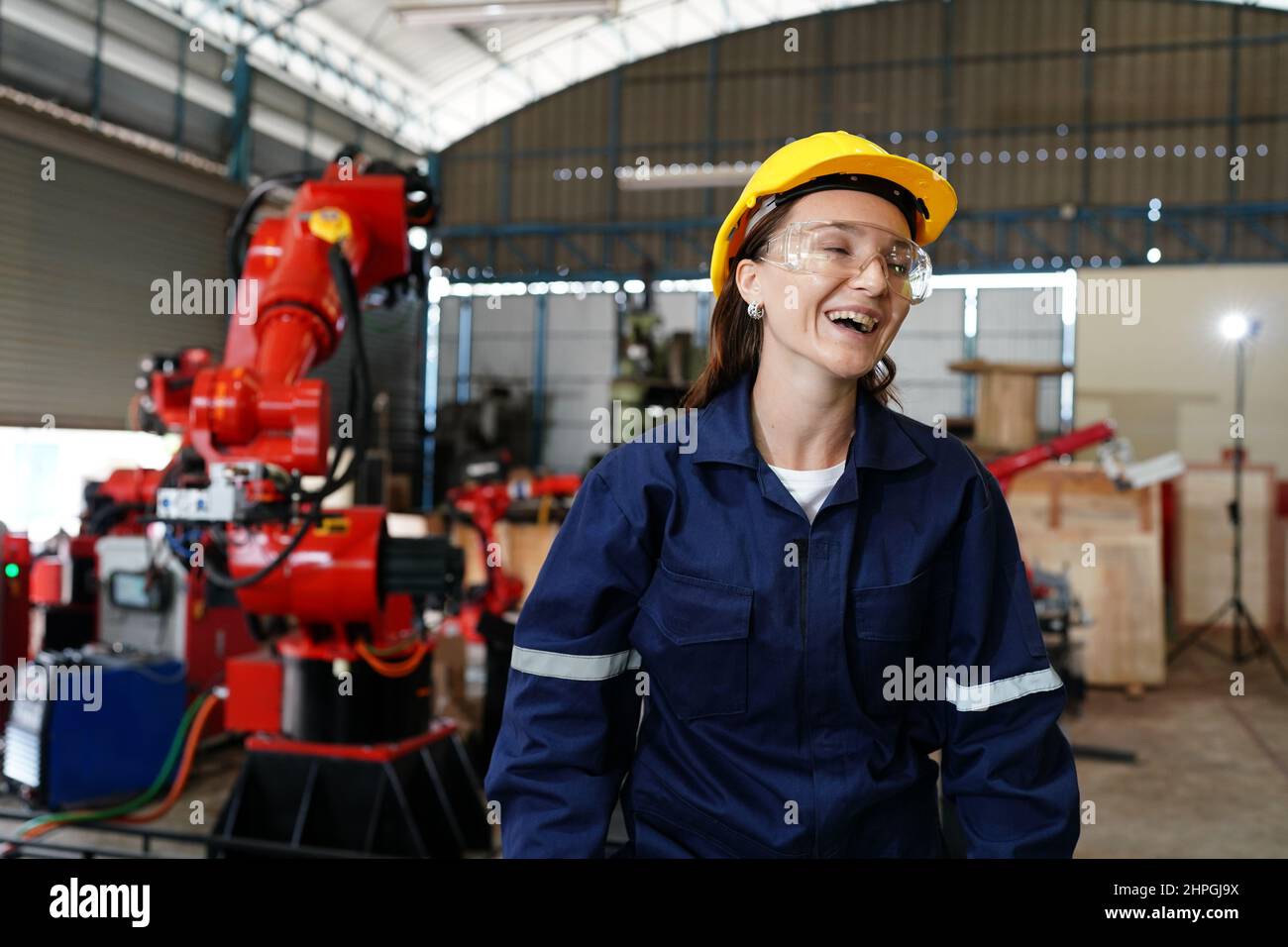 Professional young industrial factory woman employee working with ...