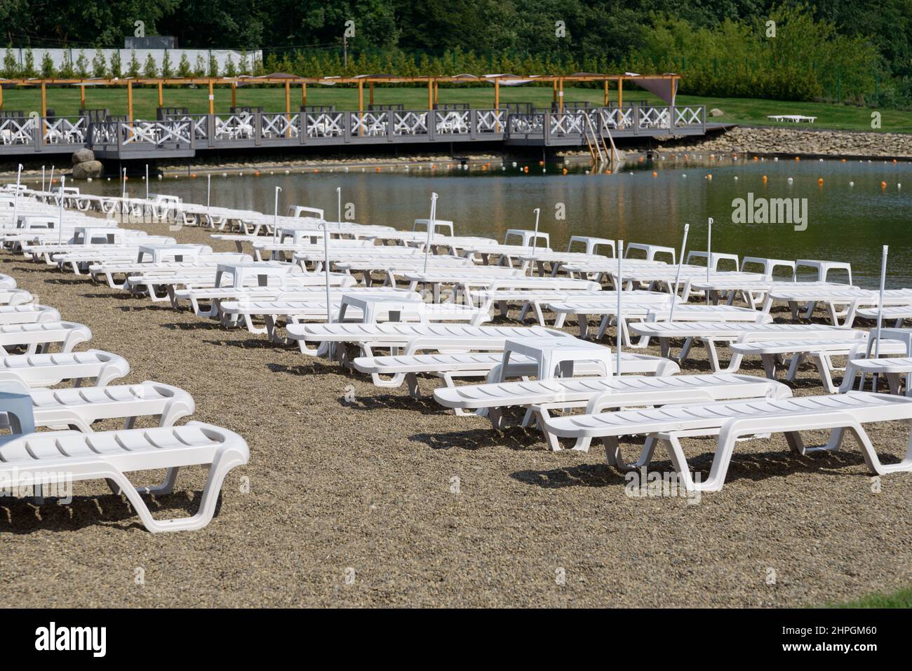 Empty sunbeds lined up on the beach Stock Photo - Alamy