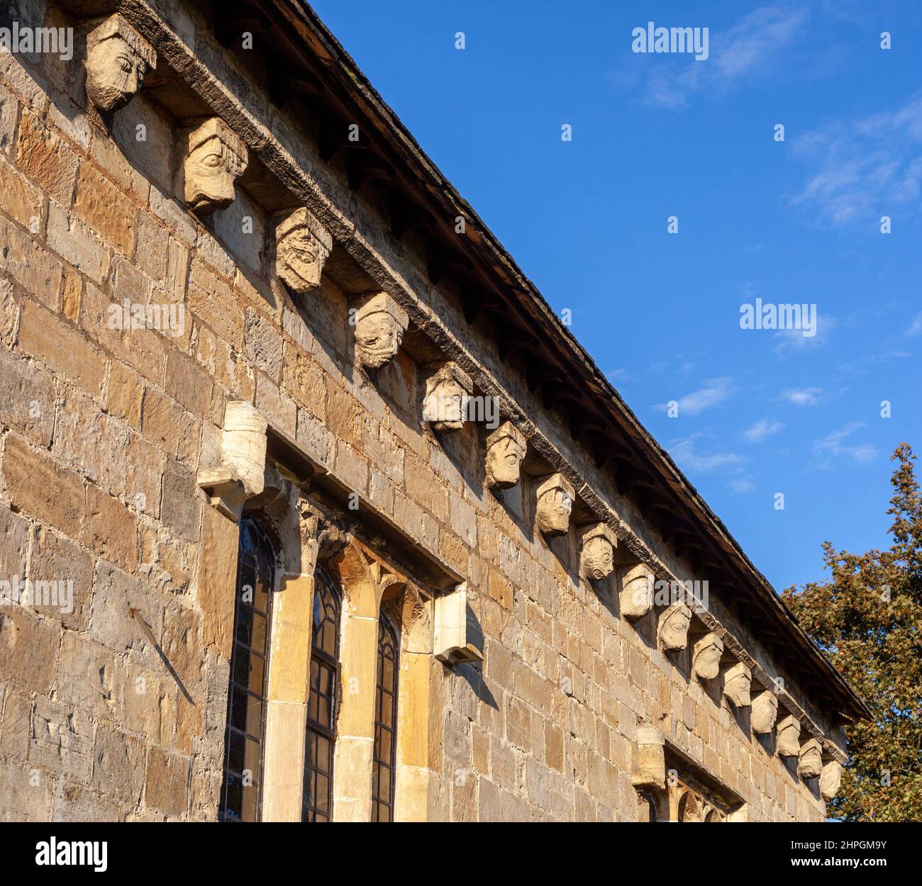 A line of medieval carved corbels on the outside of Healaugh parish ...