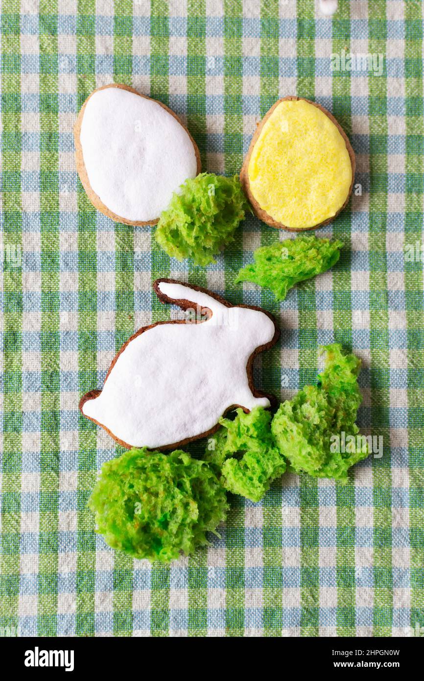 Easter gingerbread in the form of eggs and hares with colored icing and ...