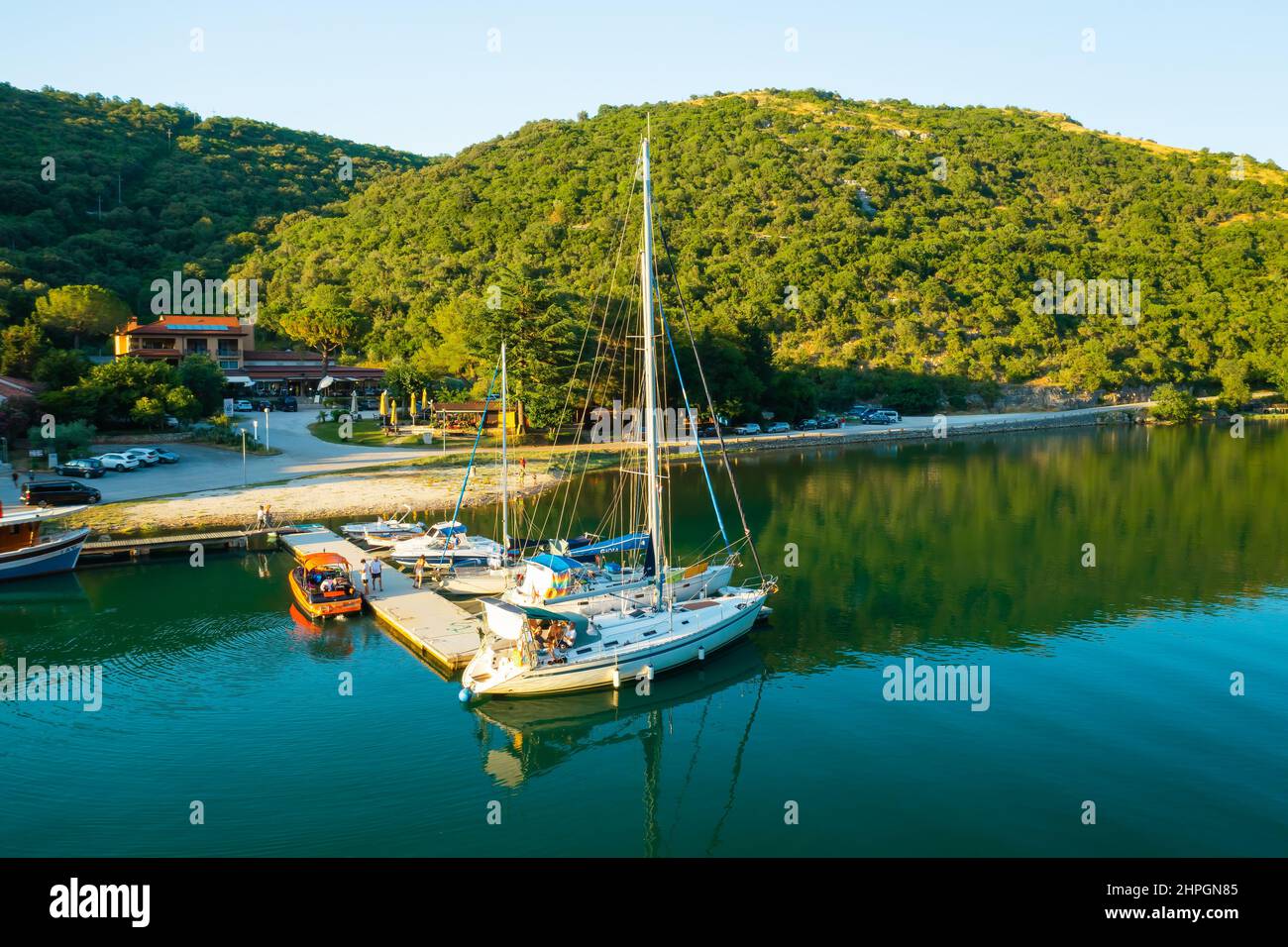 Luxurious yachts moored on marina near oyster farm surrounded by ...