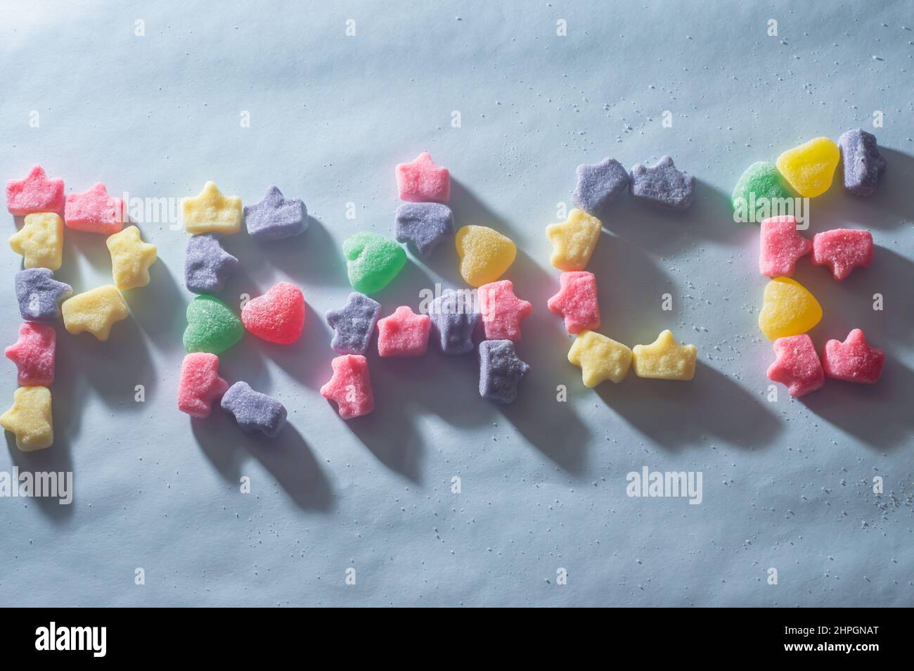 Colorful sweets varied with the word "Peace" written,light blue ...