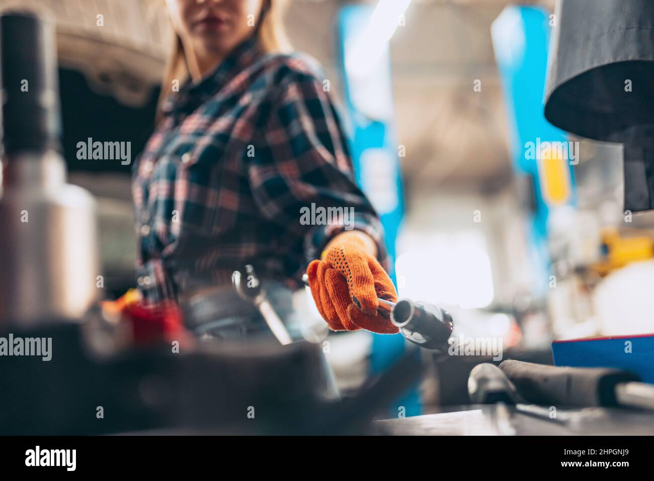 Female auto mechanic. beautiful young red-headed girl in working ...