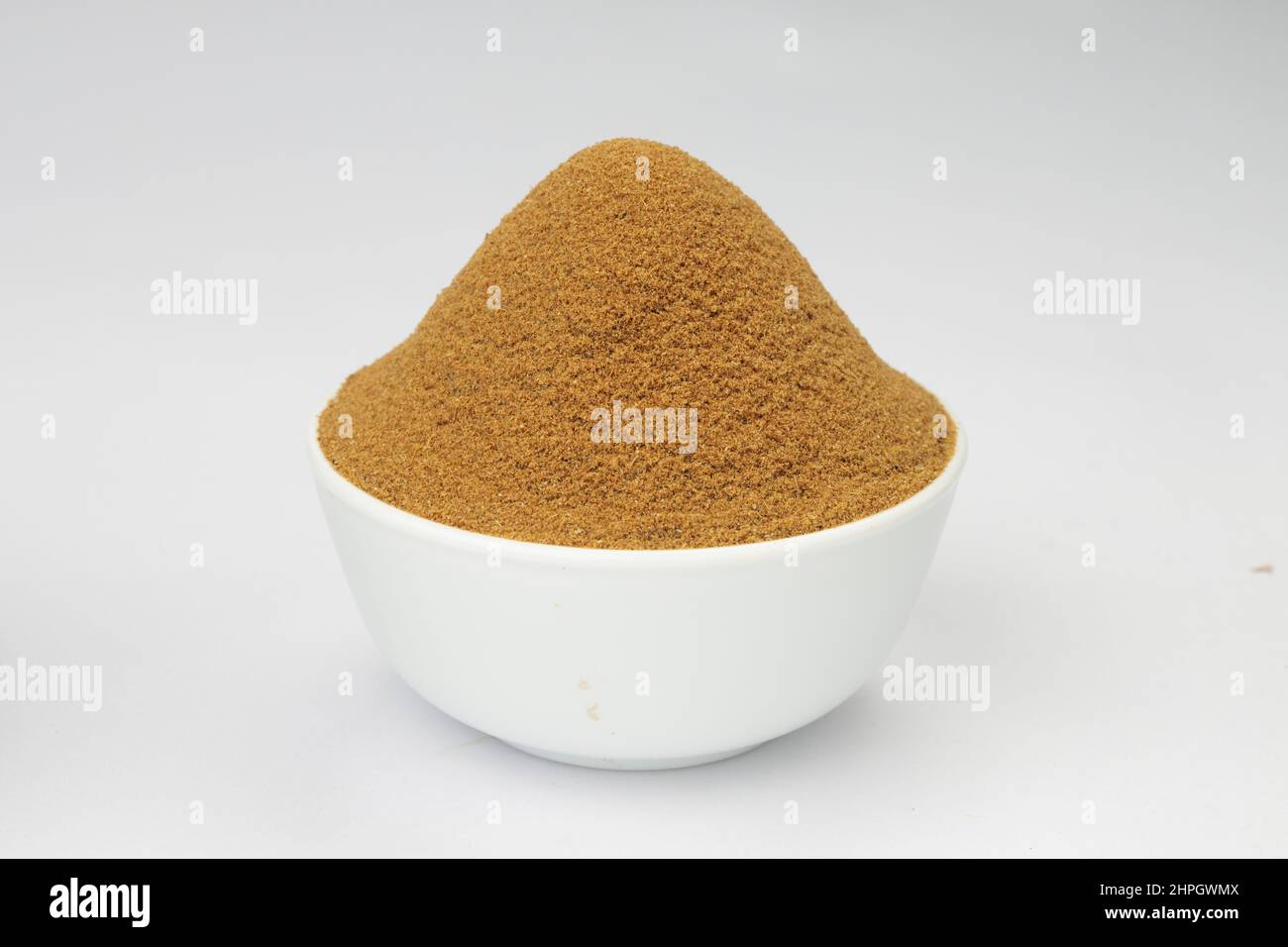 Cumin powder,Indian spices ;arranged on a white textured background ...