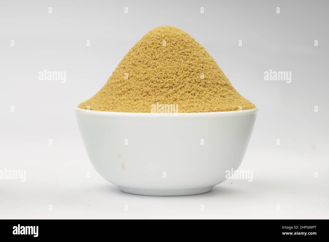 Fennel powder ,indian spice;arranged in a white bowl with white colored ...