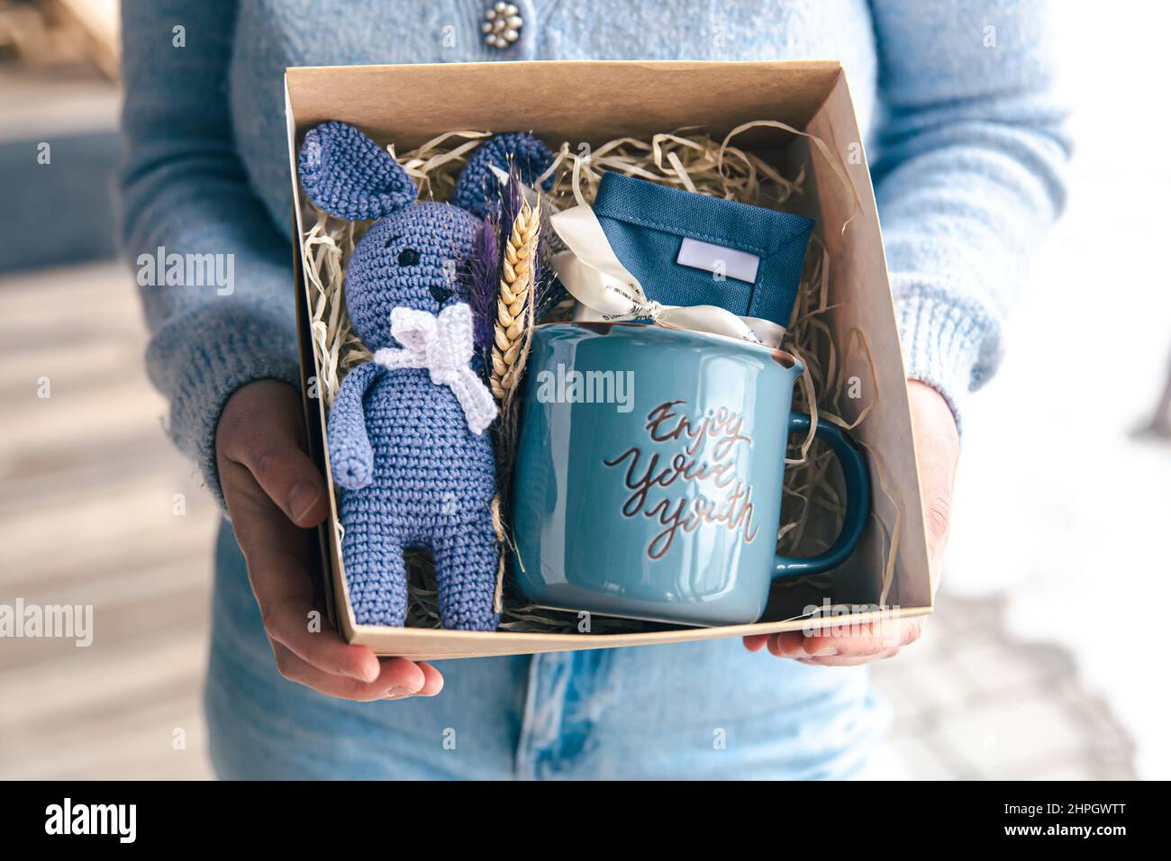 Cute gift set for the holiday, a cup and a toy in blue colors Stock ...