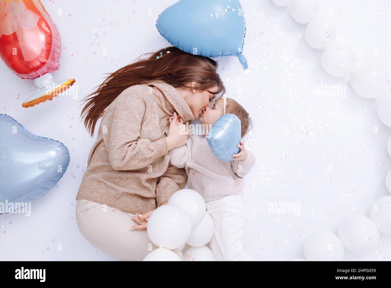Beautiful young mother and little cute daughter having fun together ...