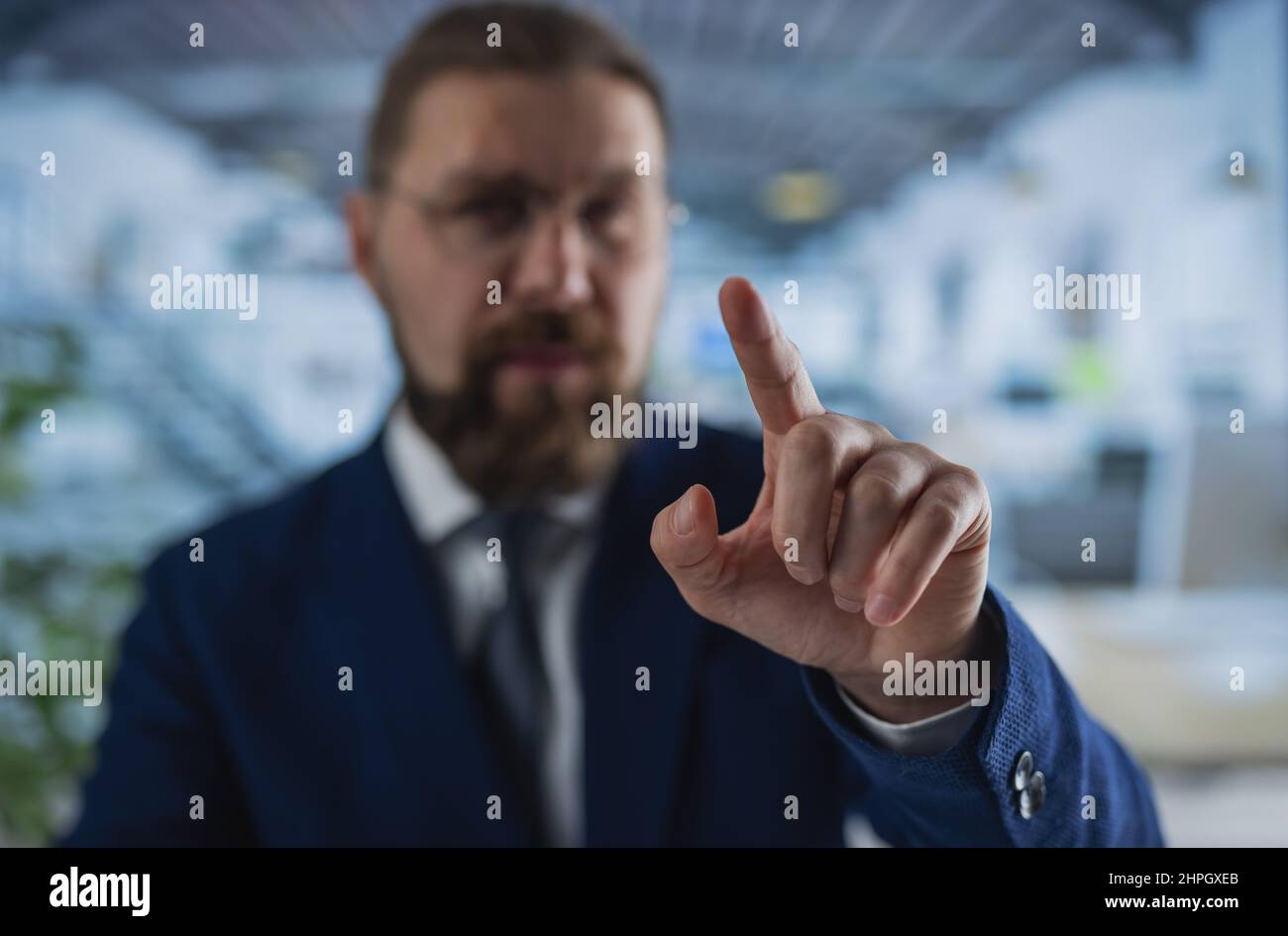 Man pointing finger a office Stock Photo - Alamy