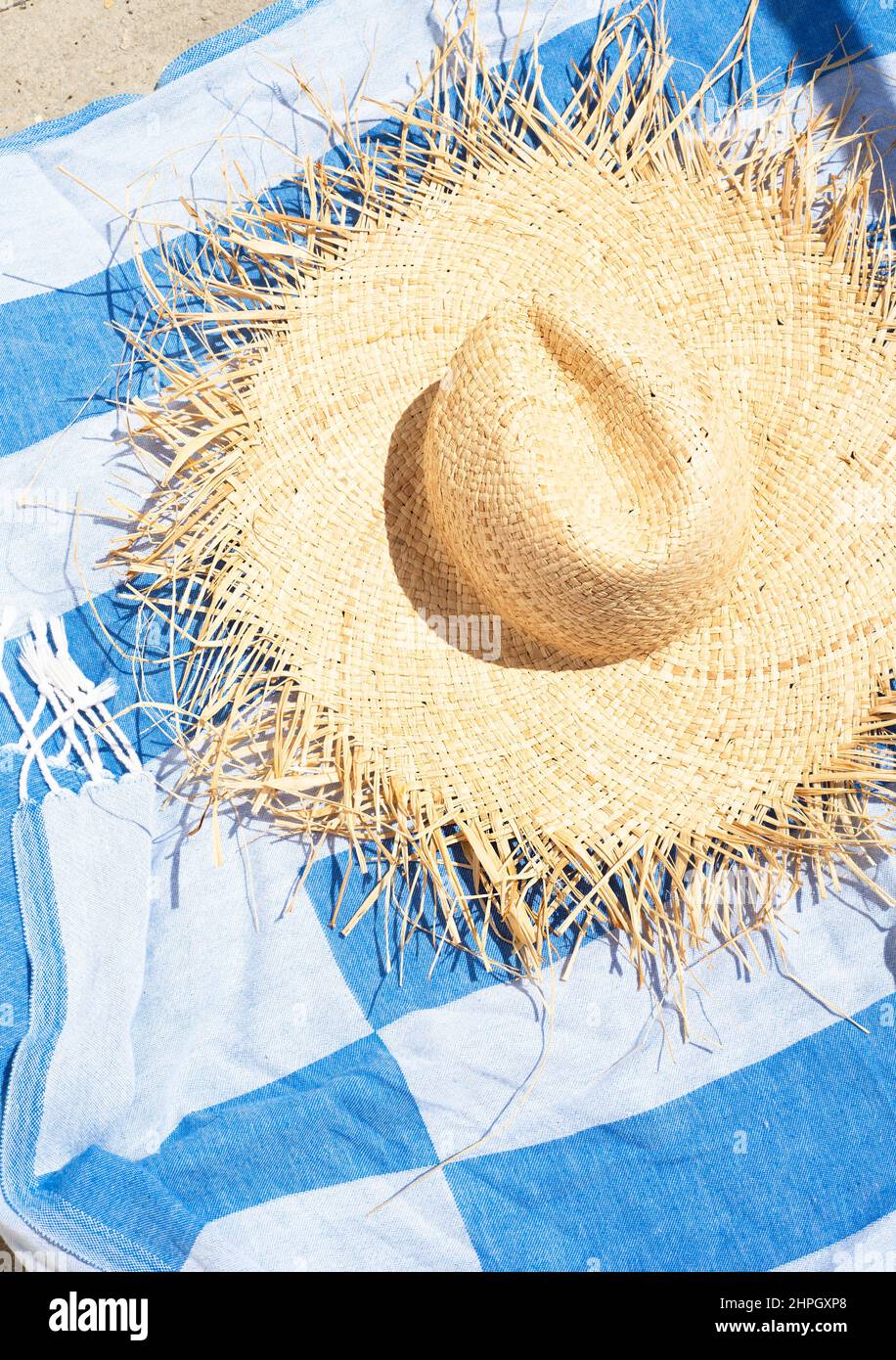 Towel and sun hat on a sandy beach hi-res stock photography and images ...