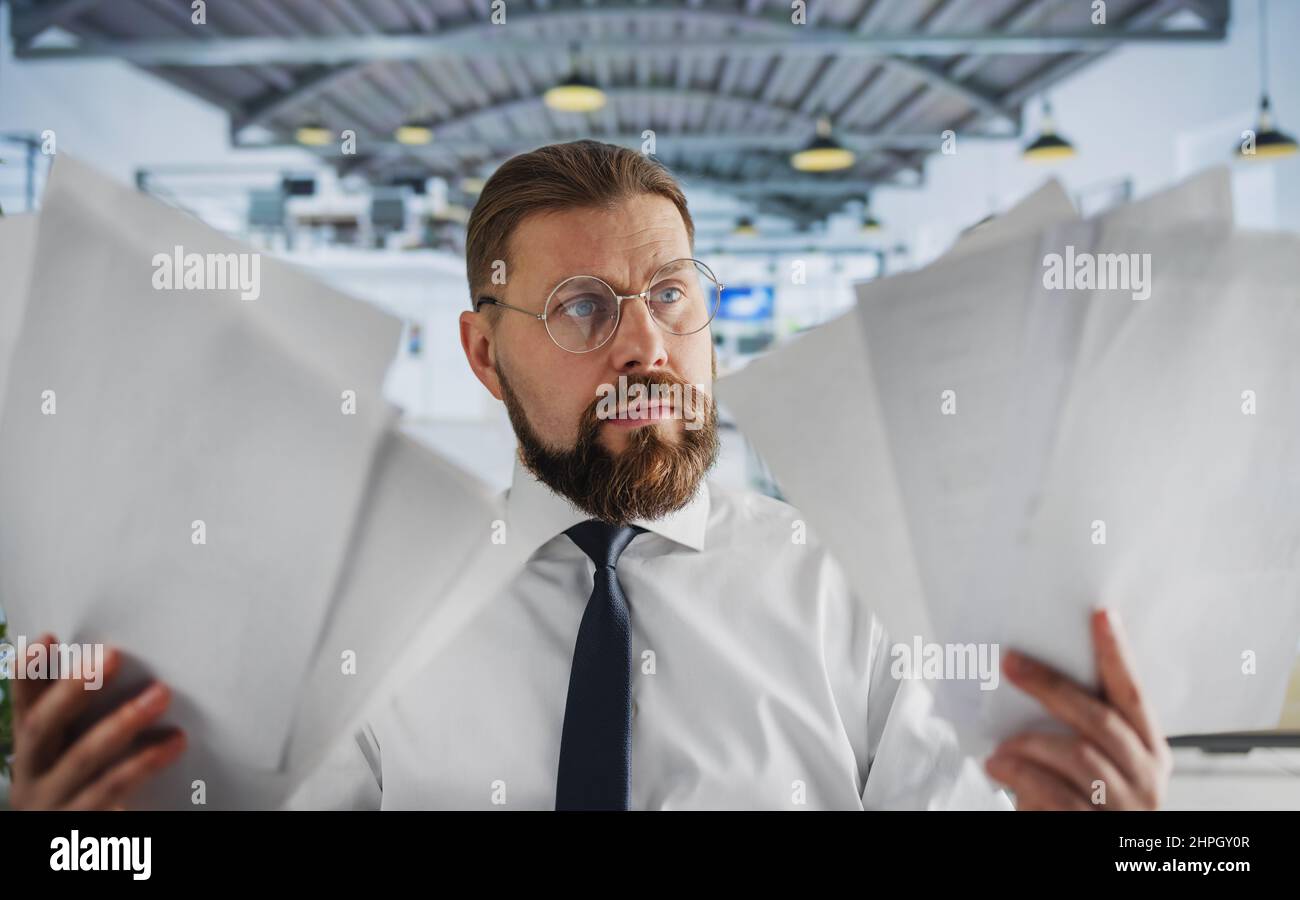 Manager overloaded with paperwork Stock Photo - Alamy