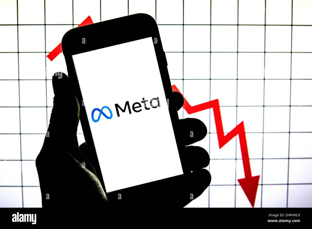 In this photo illustration a Meta Platforms Inc. logo seen displayed on a smartphone with a ...