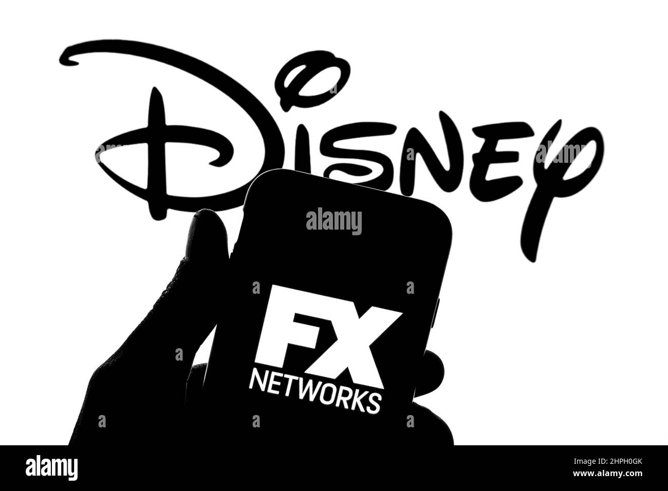In this photo illustration a FX Networks logo seen displayed on a ...