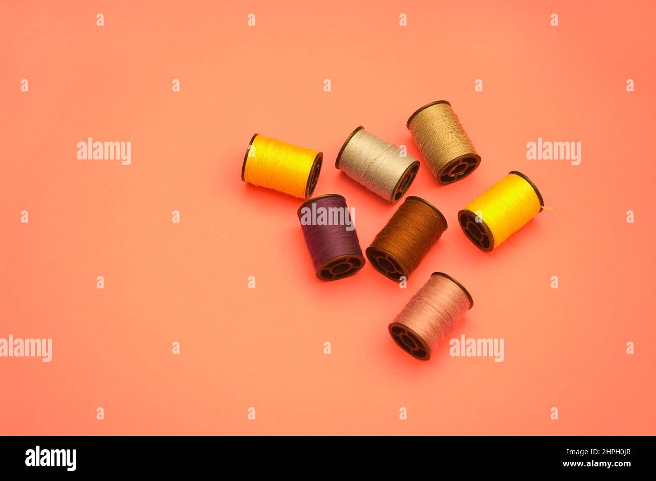 Bobbins of thread of different colors to sew clothes and make various ...