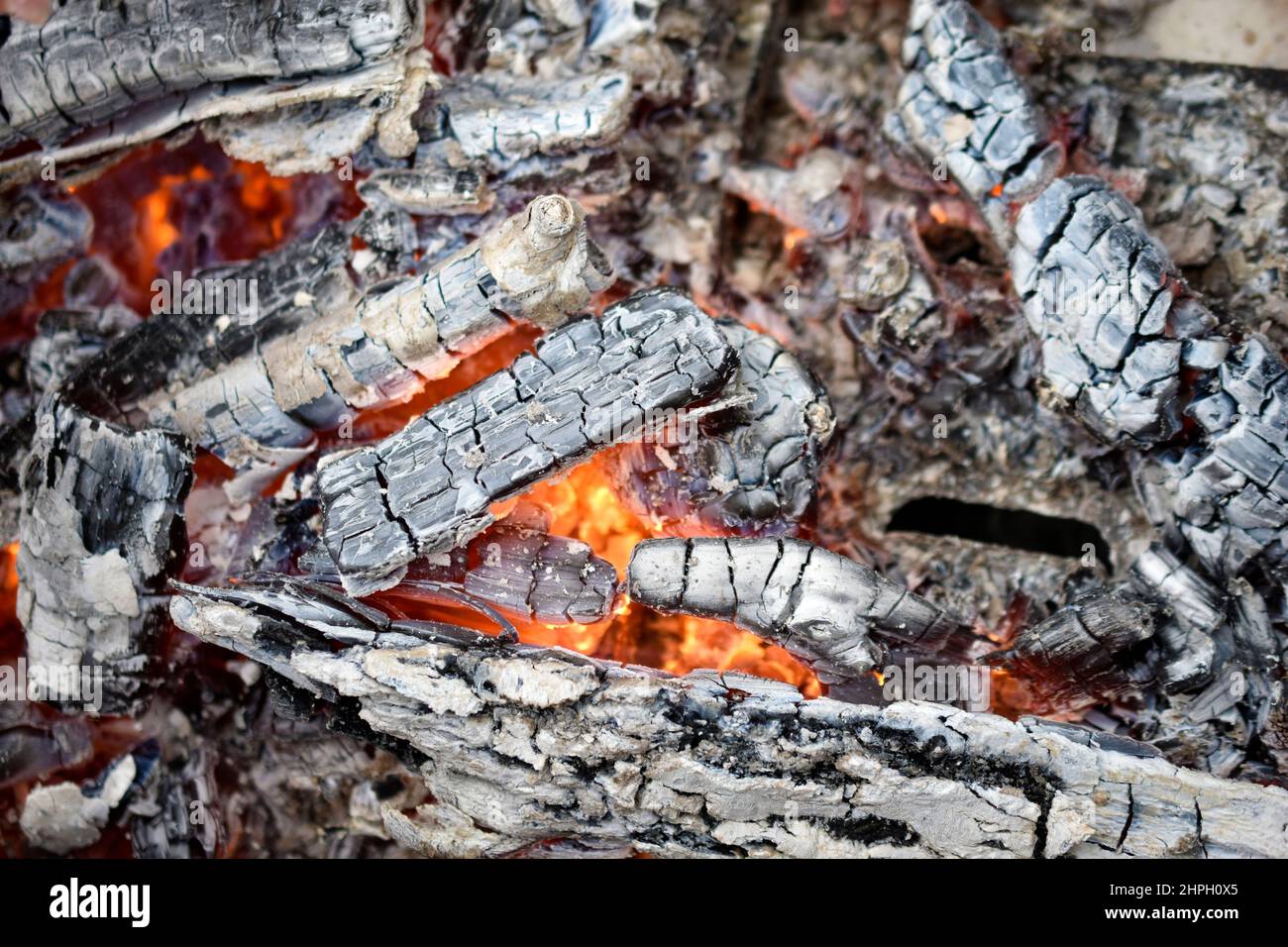 Burning coals in a fire with flames Stock Photo - Alamy