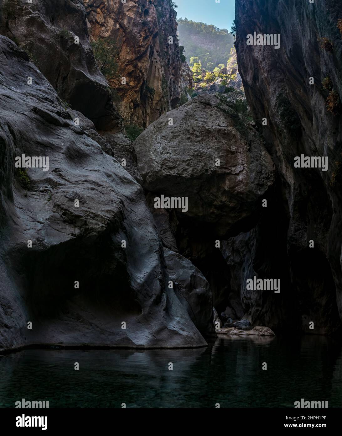 huge stone hangs stuck between two walls of the Göynük canyon in Turkey ...