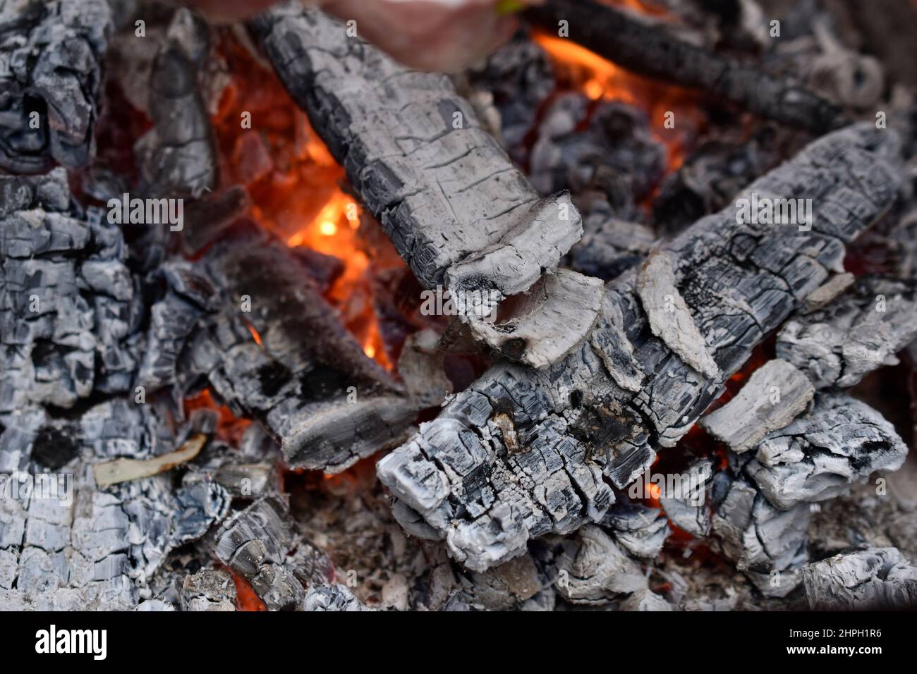 Burning coals in a fire with flames Stock Photo - Alamy