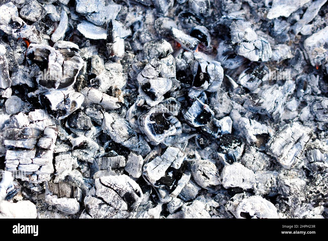 Burning coals in a fire with flames Stock Photo - Alamy