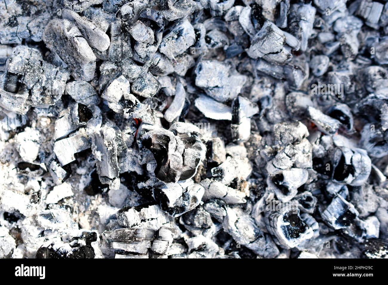 Burning coals in a fire with flames Stock Photo - Alamy