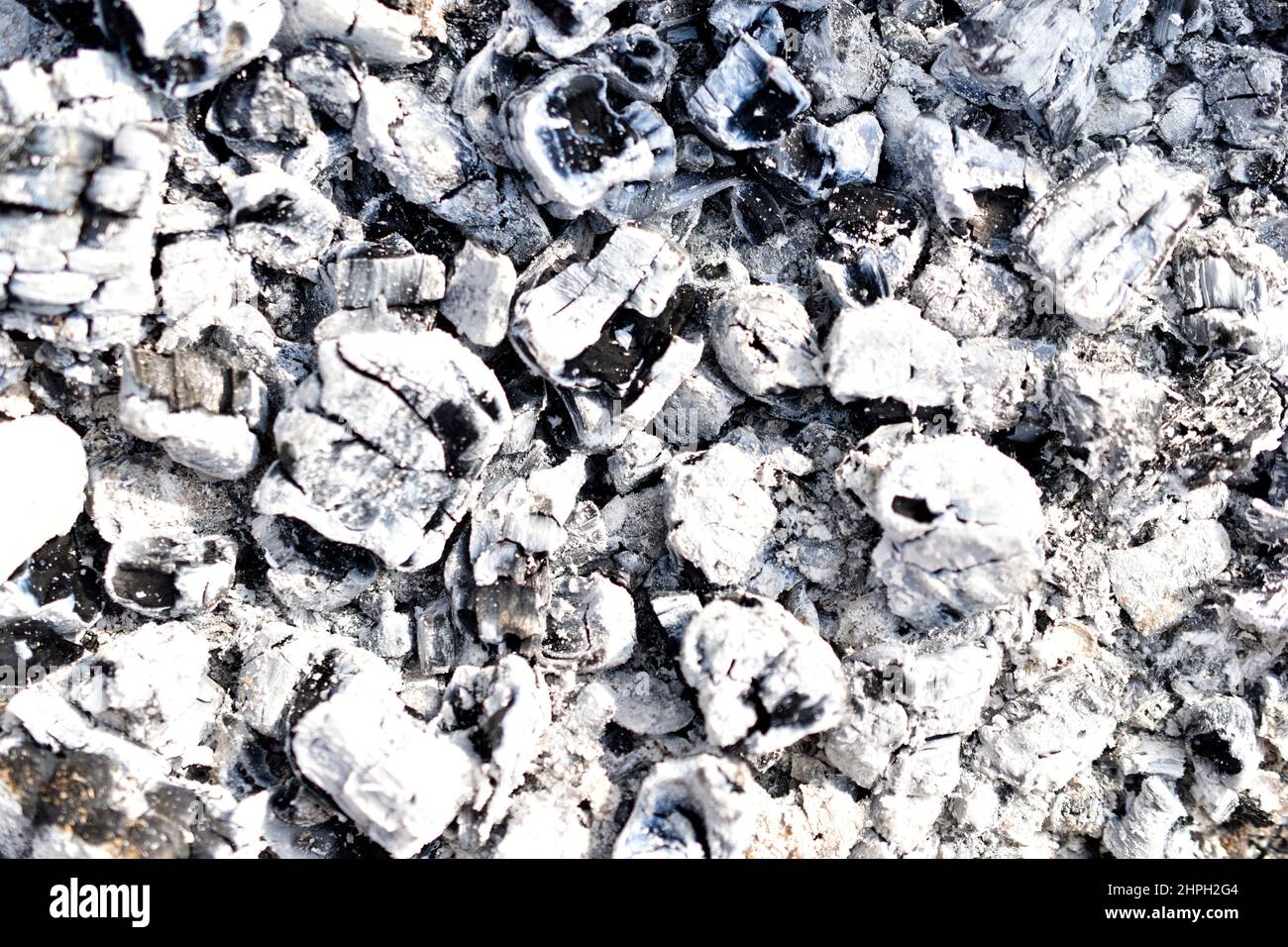 Burning coals in a fire with flames Stock Photo - Alamy