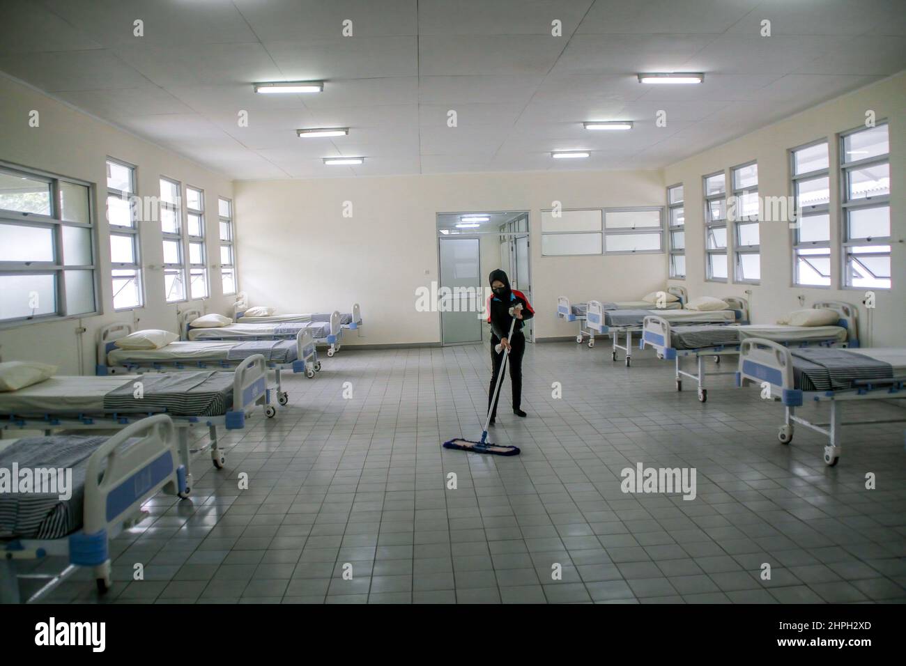 An officer seen cleaning the isolation room during a simulation of ...
