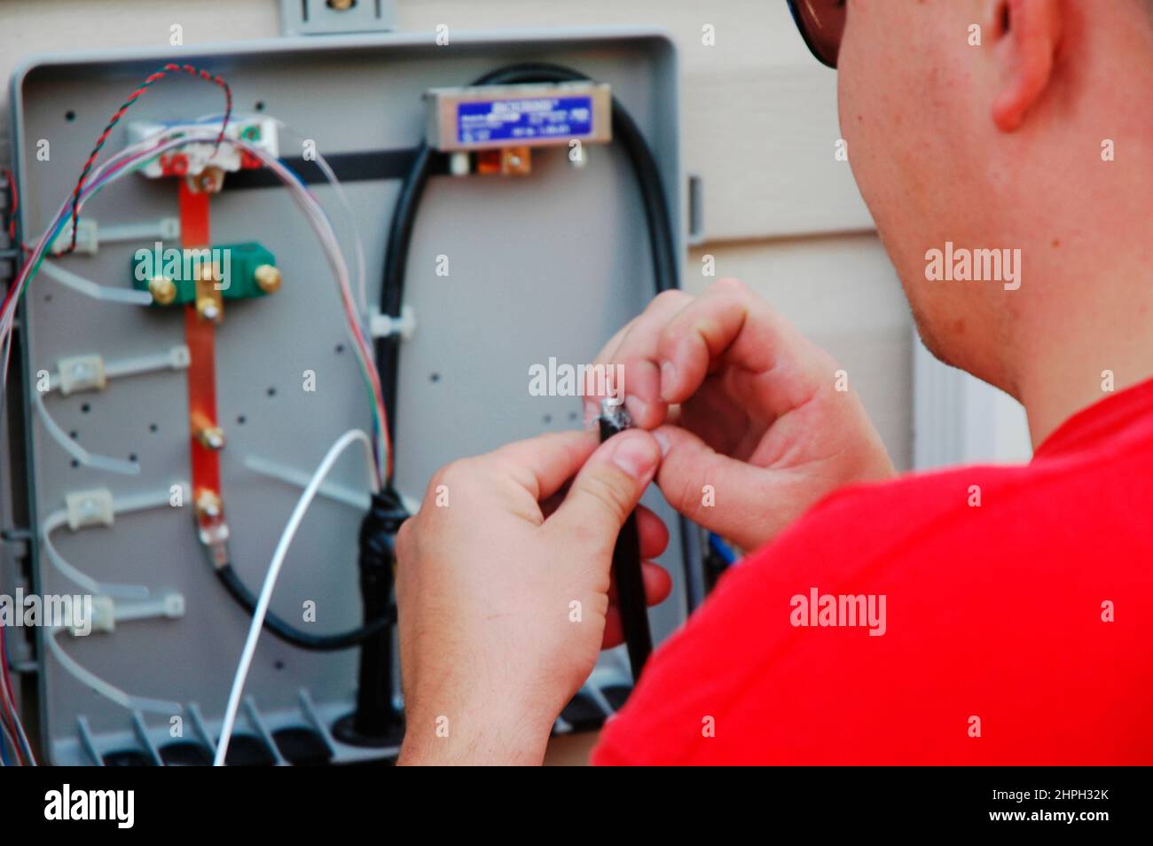 Installing cable TV and DSL lines and Phone lines on new house Stock ...