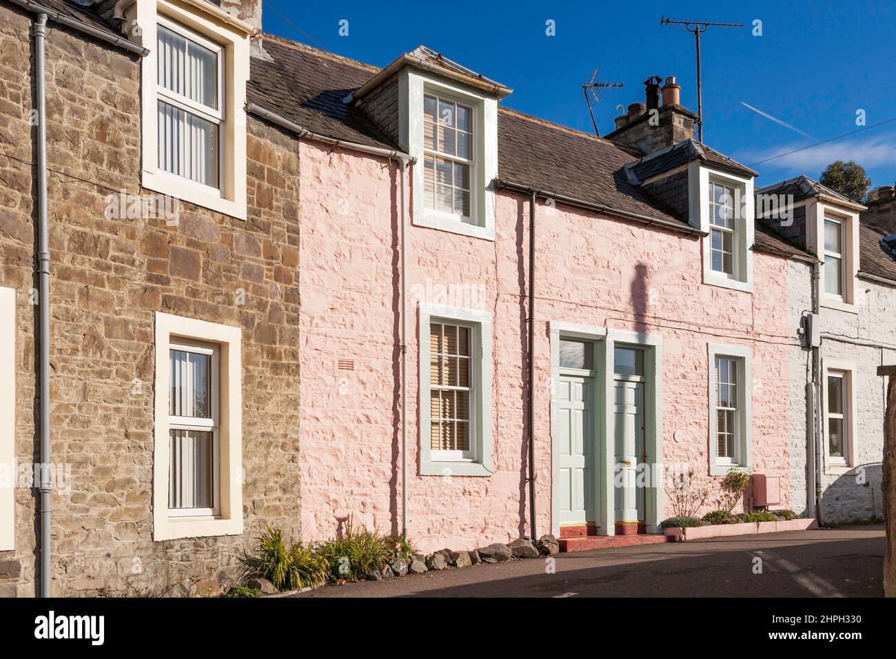 Painted terraced cottages with dormer windows in Eastgate, Moffat ...