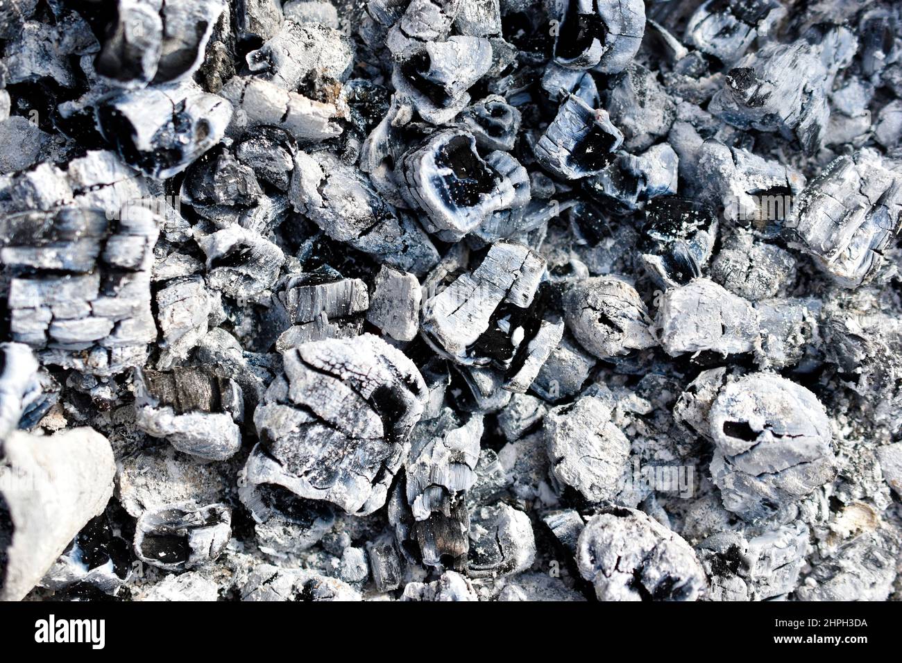 Burning coals in a fire with flames Stock Photo - Alamy