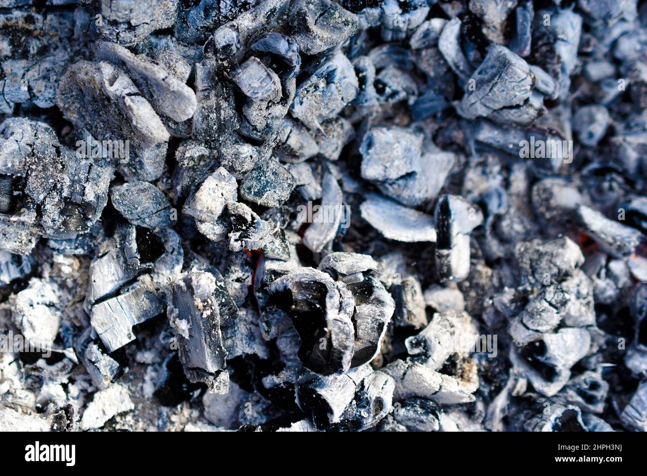 Burning coals in a fire with flames Stock Photo - Alamy