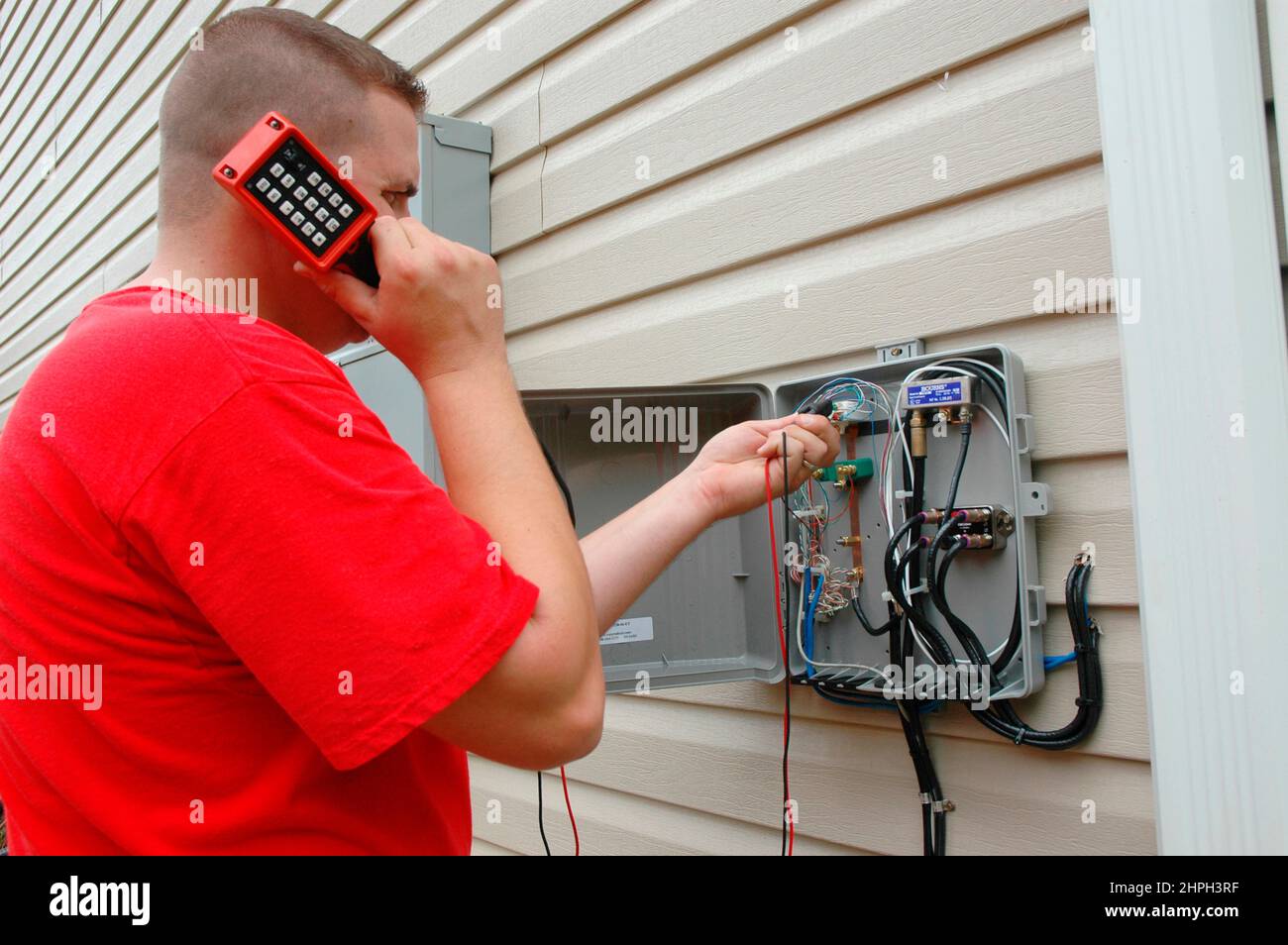 Installing cable TV and DSL lines and Phone lines on new house Stock ...