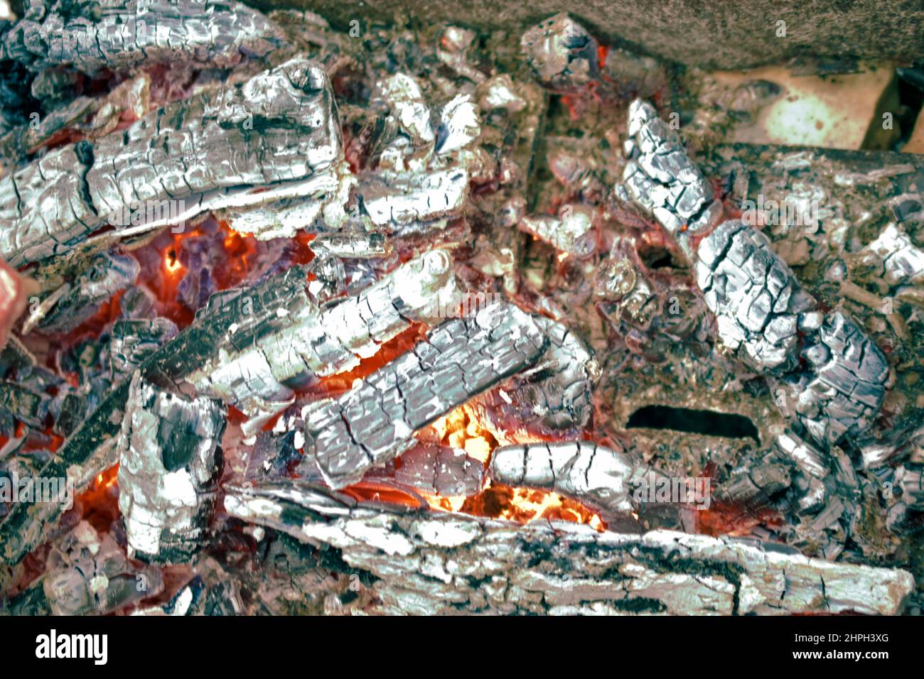 Burning coals in a fire with flames Stock Photo - Alamy