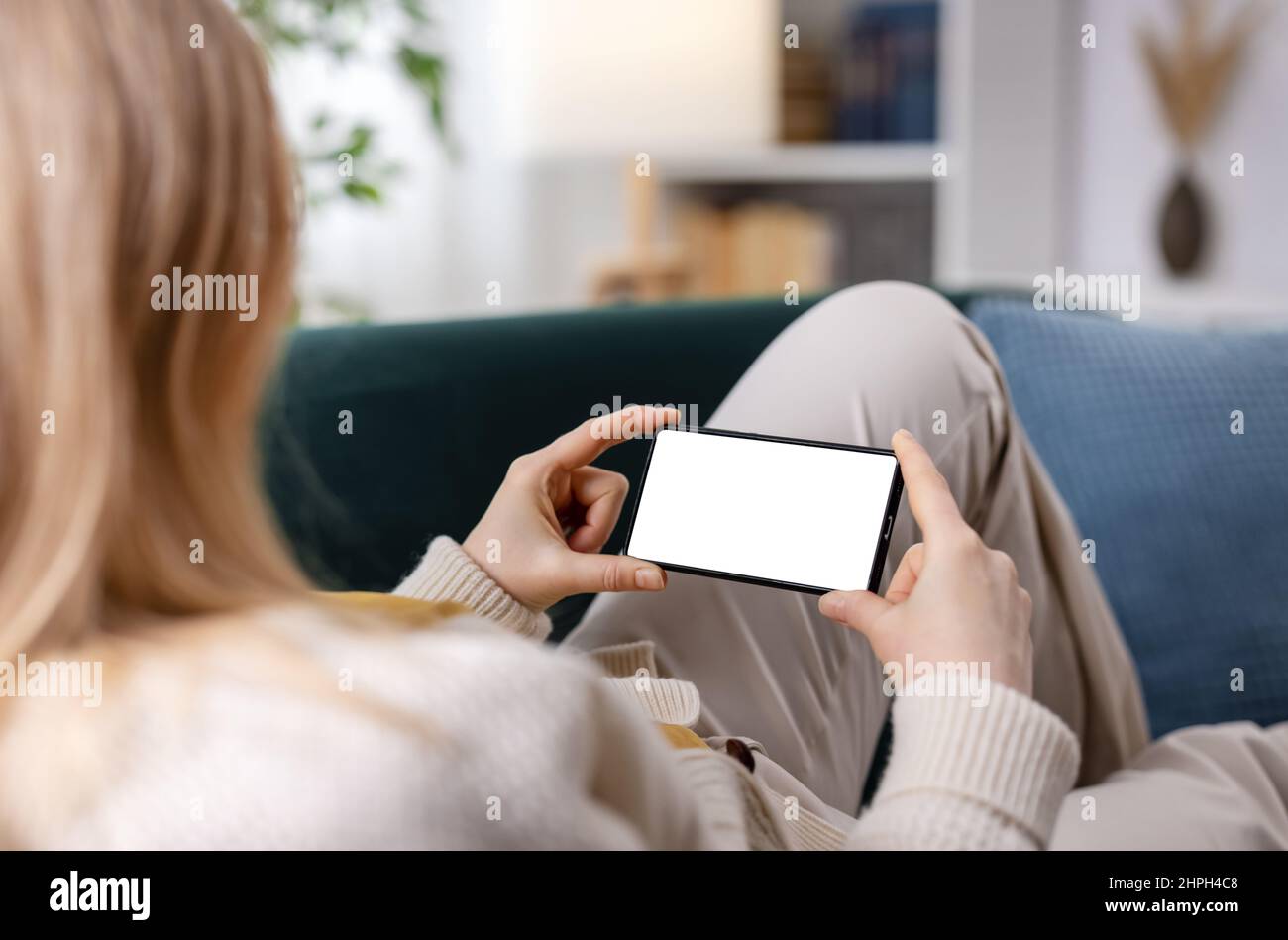 Woman lying couch home using cell phone hi-res stock photography and images - Alamy