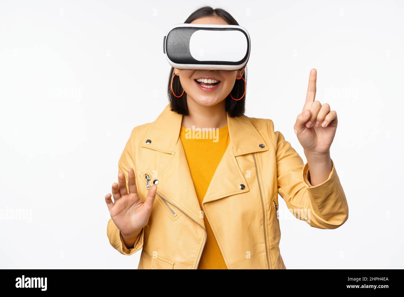 Image of young asian woman wearng VR headset, using virtual reality ...