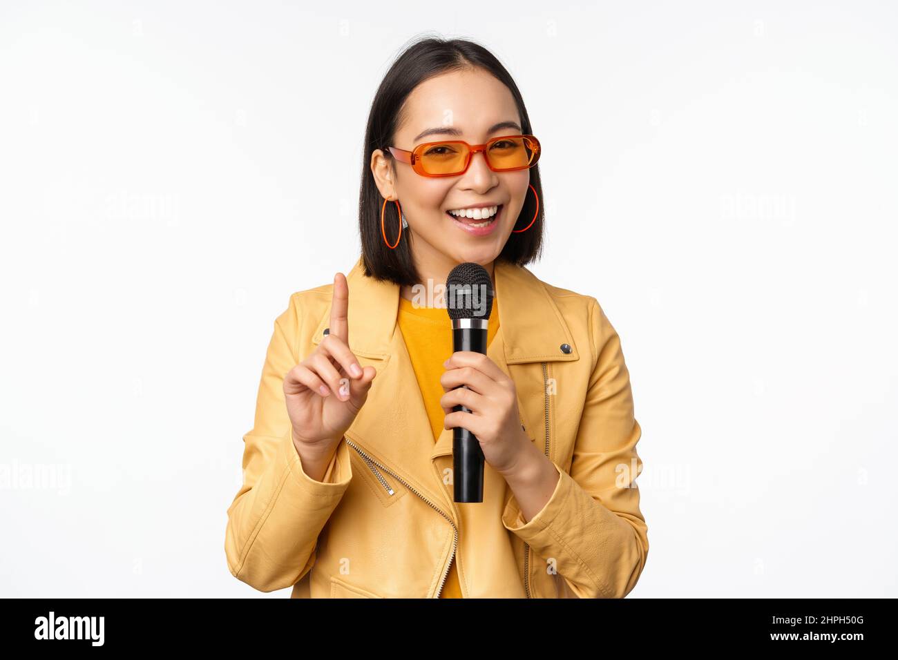 Hand holding microphone over white hi-res stock photography and images ...
