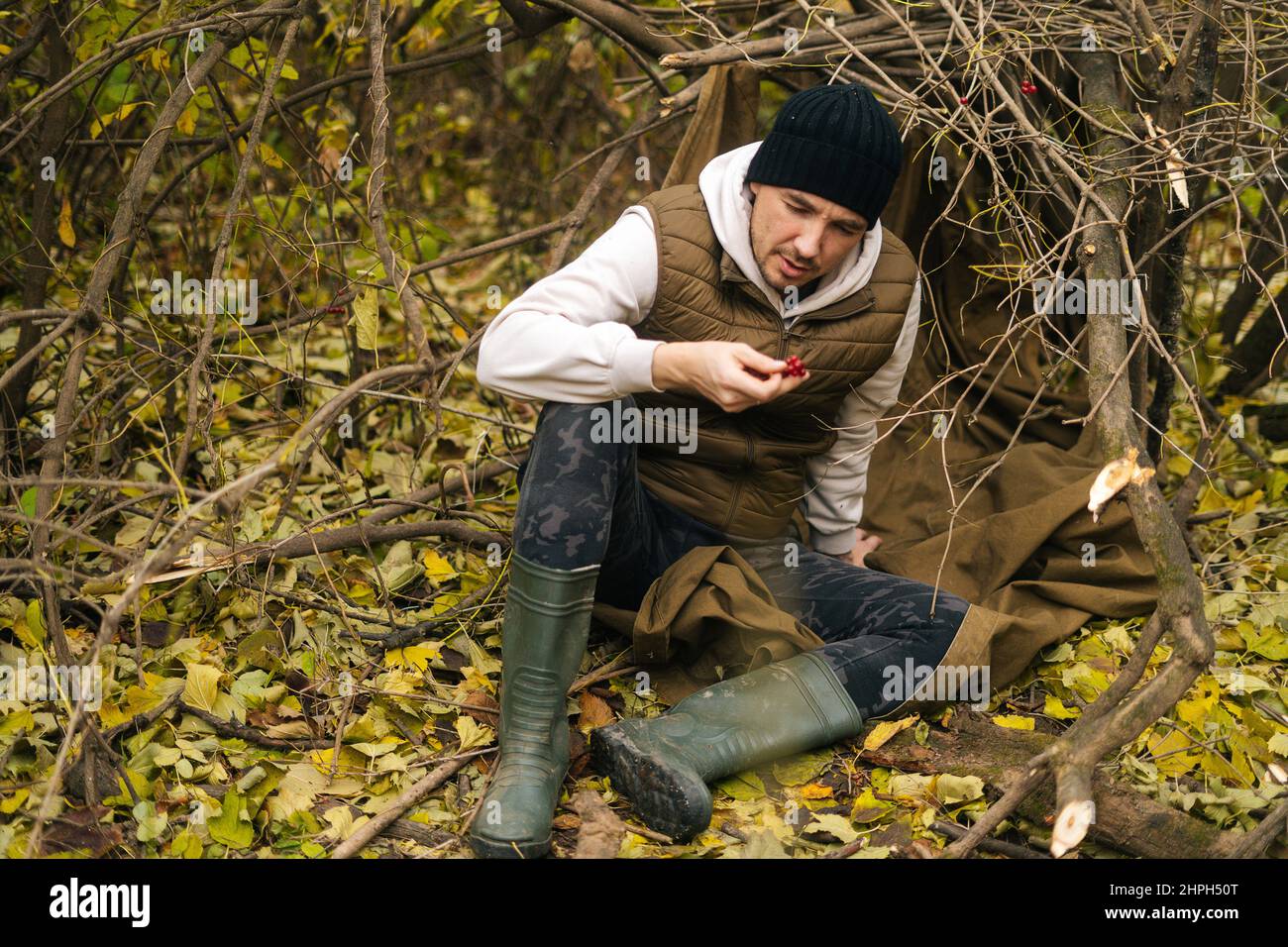Man sitting alone under tree hi-res stock photography and images - Alamy