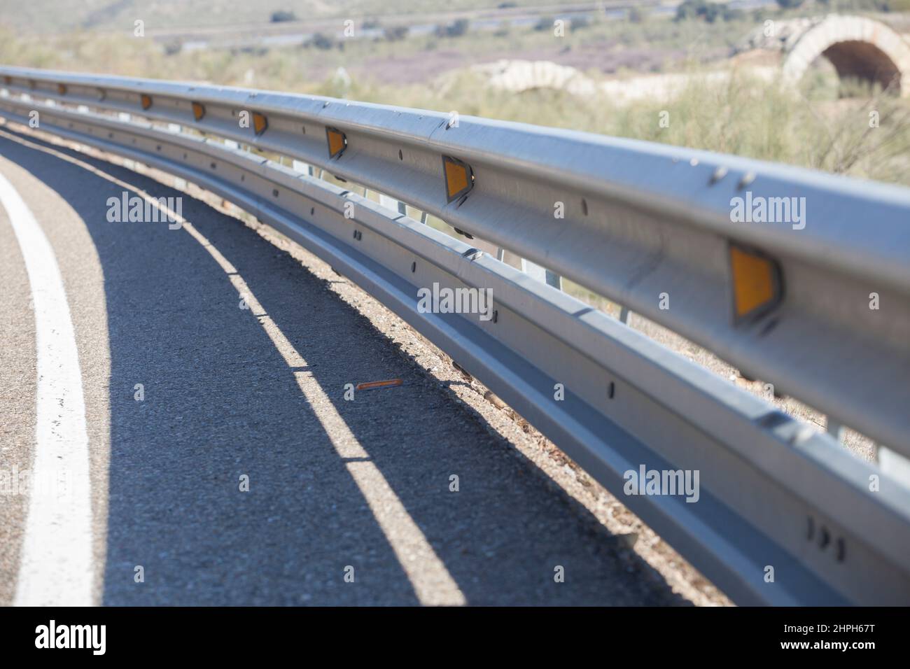 Guardrails poles covered crash-absorber beam. Shoulder view. Motorists ...