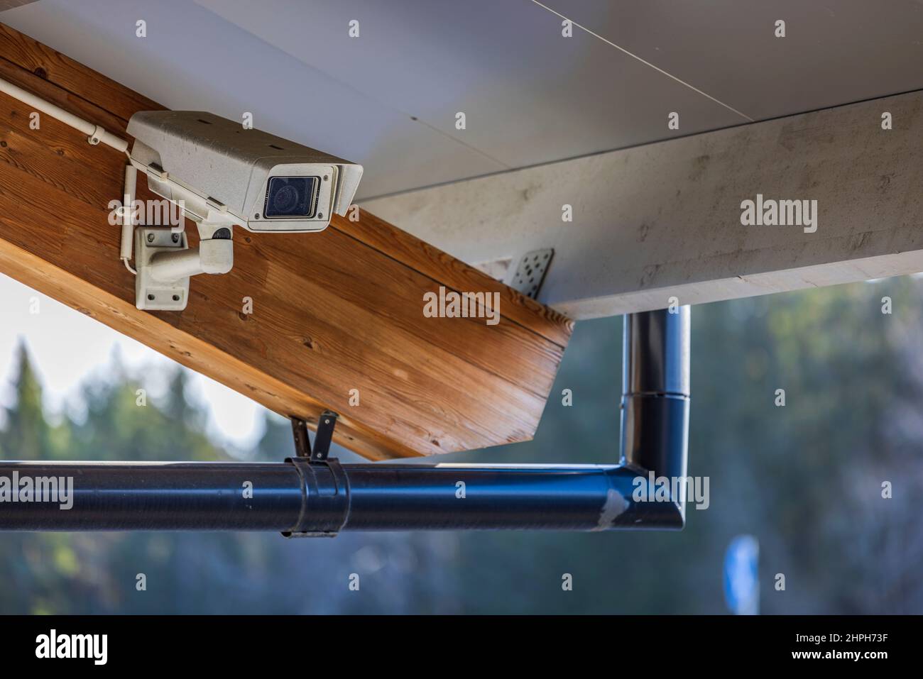 Close up view of safety surveillance camera under roof house. Sweden ...
