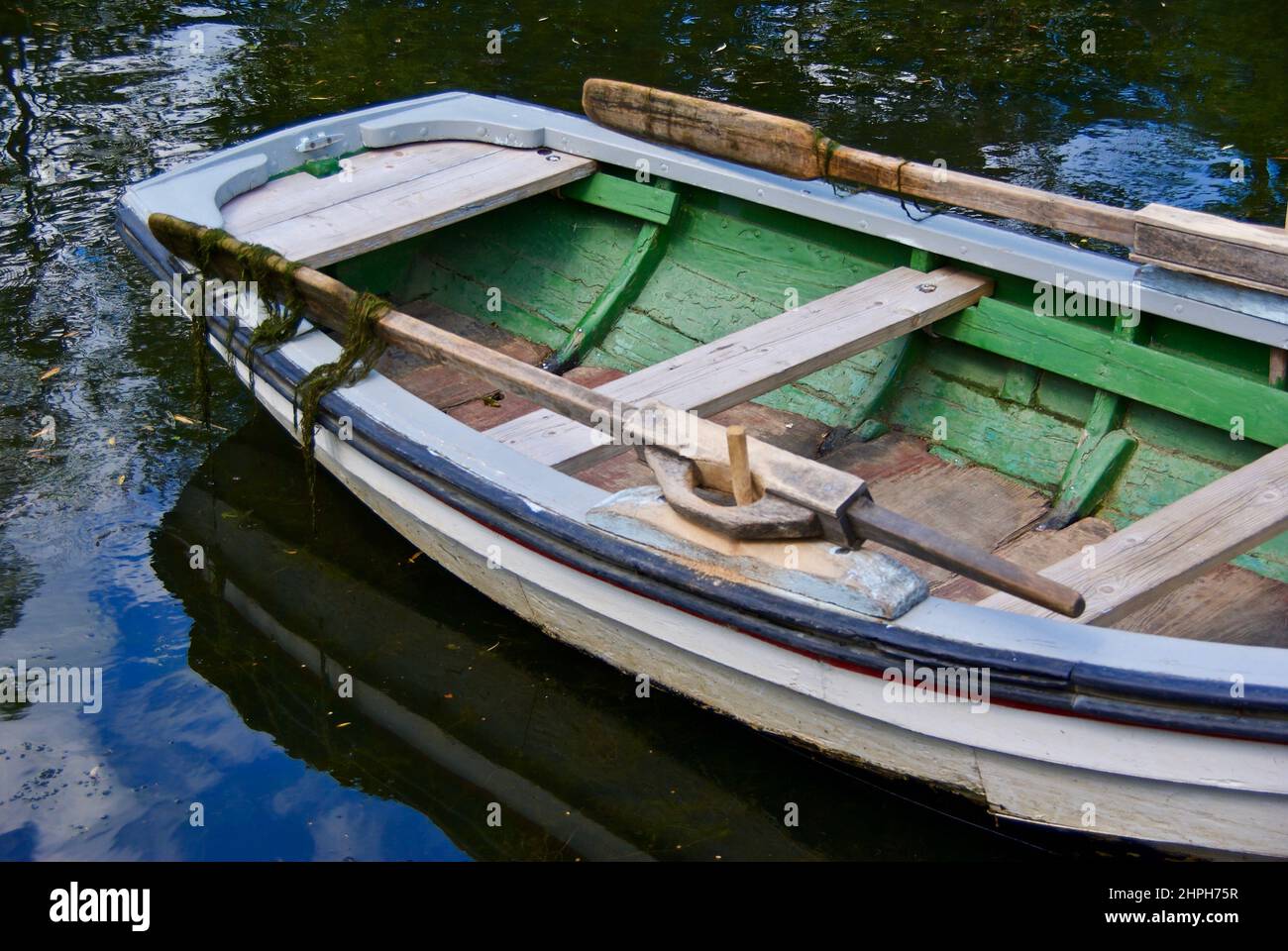 Old wooden rowing boat for hire at a pond Stock Photo - Alamy