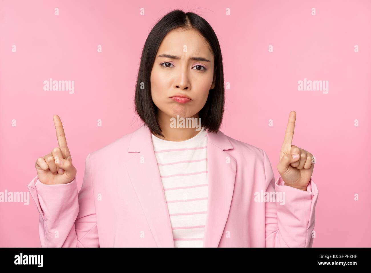 Sad asian business woman, professional corporate manager pointing ...