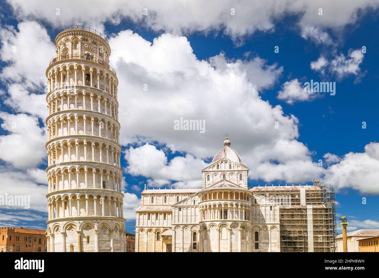 The Leaning Tower of Pisa and cathedral in Square of Miracles at sunny ...