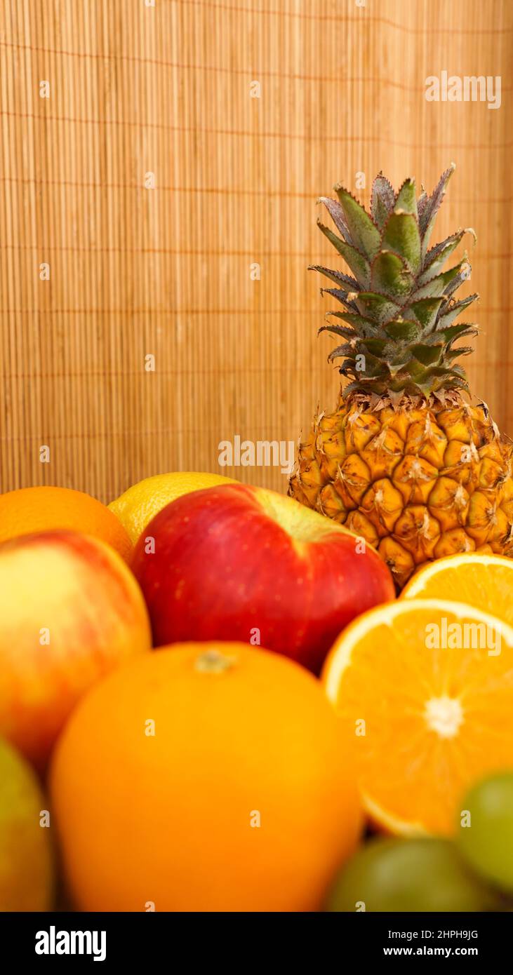 Spring or Summer concept. Many kinds of fruit. Vertical photo, can use ...