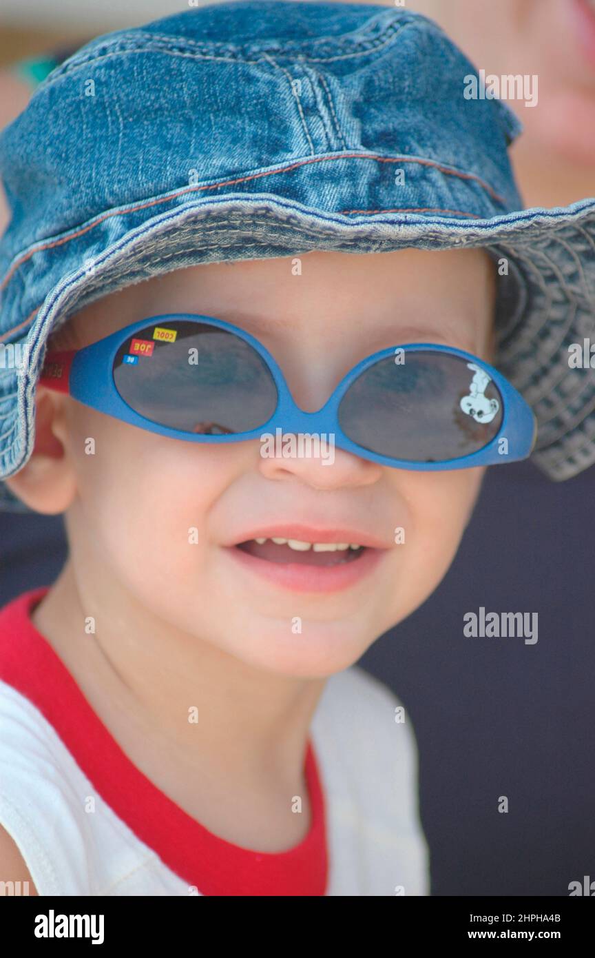 20 month old boy child baby with blue hat and sunglasses and some with ...